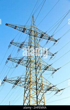 electrical pylon under blue sky, power line cable Stock Photo - Alamy