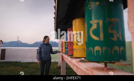 Colorful wooden prayer drums, khurde. Attribute used in Buddhist ...
