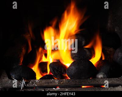 A close-up of the flames in a home fire pit in long exposure Stock ...