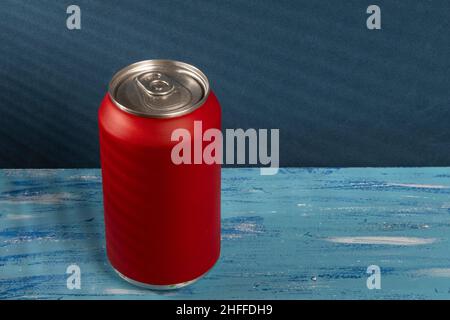 red soda can on blue background and with ice and cold Stock Photo - Alamy