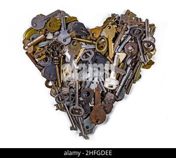 Heart shaped retro metal keys on white background Stock Photo - Alamy