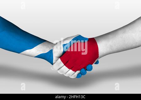 Handshake between Japan and Scotland flags painted on hands, isolated ...