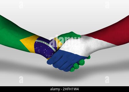 Handshake between brazil and netherlands flags painted on hands ...