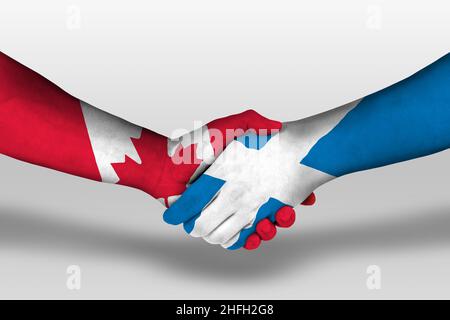 Handshake between Canada and Scotland flags painted on hands, isolated ...