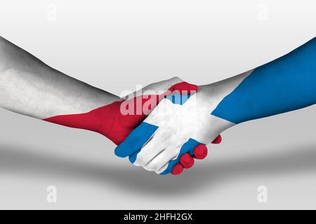 Handshake between Poland and Scotland flags painted on hands, isolated ...