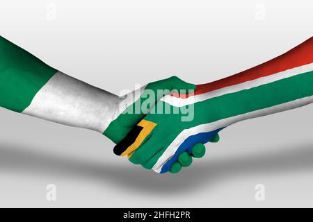 Handshake between nigeria and south africa flags painted on hands ...