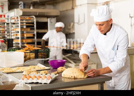 portrait male baker making cookies in bakehouse Stock Photo - Alamy
