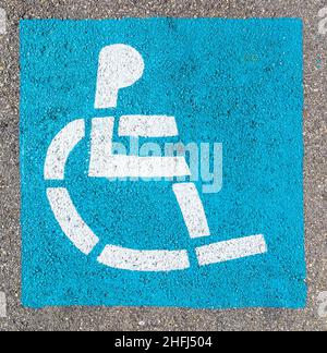 wheelchair sign at the parking lot in blue Stock Photo - Alamy