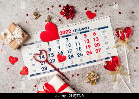 Flat lay of Valentines day calendar composition. Top view Gifts, paper ...