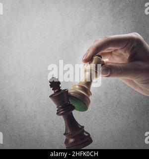 The king is checkmated and defeated, player knocking the opponent king ...