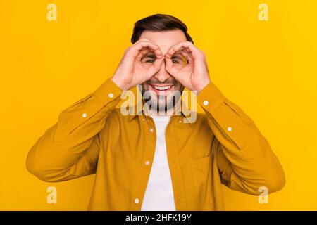 man with binoculars over yellow background, panoramic layout Stock ...