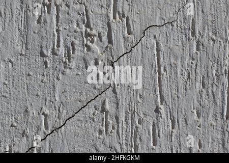 Diagonal line on a white plaster wall with two colors - light texture ...