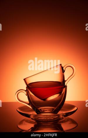 Two cups of tea against colorful background Stock Photo - Alamy
