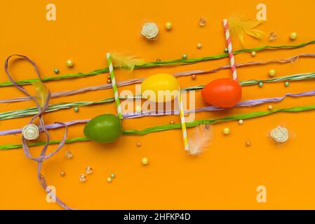 Musical notes make from Easter eggs on yellow background. Easter ...