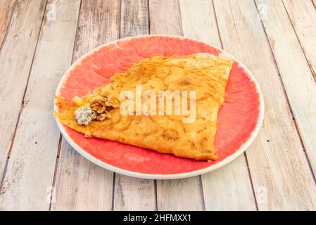 Mediterranean cuisine: crepes stuffed with cheese and spinach. Healthy ...