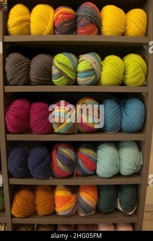 Colourful balls of wool on shelves Stock Photo - Alamy