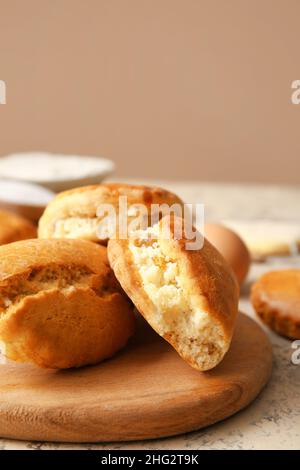Board of tasty sochniki with cottage cheese on table, closeup Stock ...
