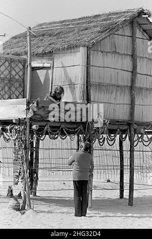 Indian Siddha Yogi saint Devraha Baba, sits on his machan, a high wood ...
