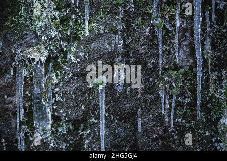 Icicles on stone Stock Photo - Alamy