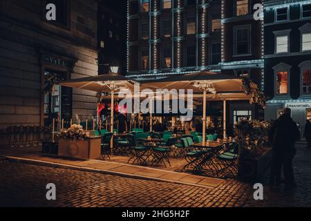 The Ivy Restaurant in London at night with stained glass windows and ...