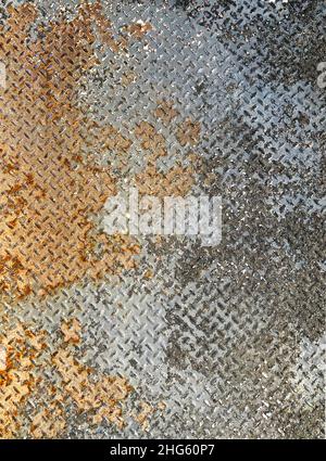 Rusty worn out tread plate with a diamond pattern used for slip ...