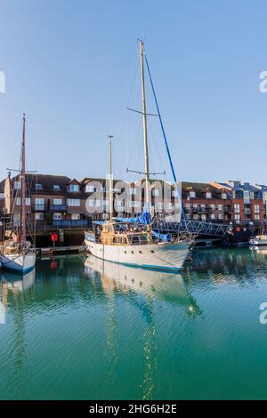 Sailboats the old style moored in the harbour of Imperia during stage ...