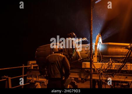 Aviation Machinist's Mate conducts an engine cell test on the fantail ...