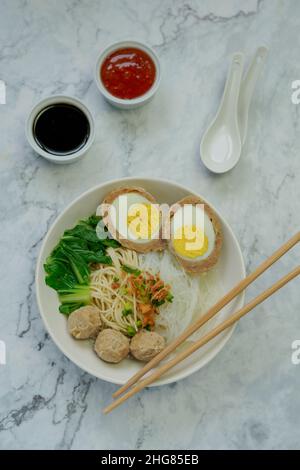 Bakso telur is Indonesian street food contain meatballs with boiled ...