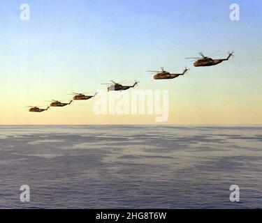 In-flight RH-53D Sea Stallion helicopters as seen from the cockpit of ...