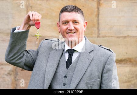 CraigThomson after receiving his MBE during an Investiture ceremony at ...