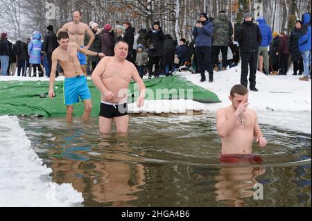 Lviv, Ukraine. 19th Jan, 2022. A woman takes a bath in cold water ...