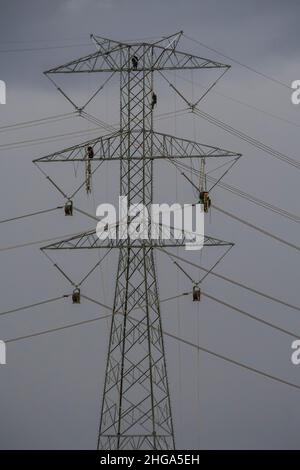 Installation and assembly of high-rise electrical towers Stock Photo ...