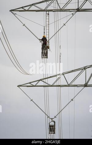 Installation and assembly of high-rise electrical towers Stock Photo ...