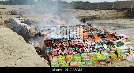 View of burning pile of confiscated drugs during the incineration ...