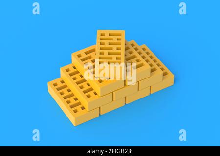 Perforated clay bricks on blue background. Home construction. Building ...