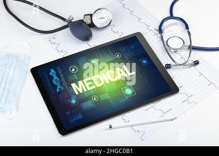 Tablet pc and medical stuff Stock Photo - Alamy