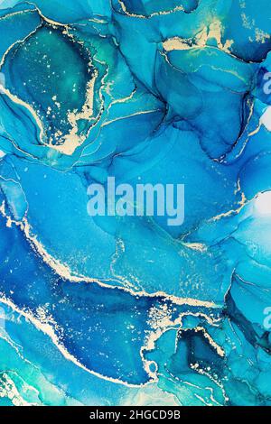 Alcohol ink blue and gold abstract stains on white background. Drops ...