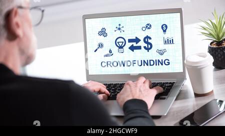 Laptop screen displaying a crowdfunding concept Stock Photo - Alamy