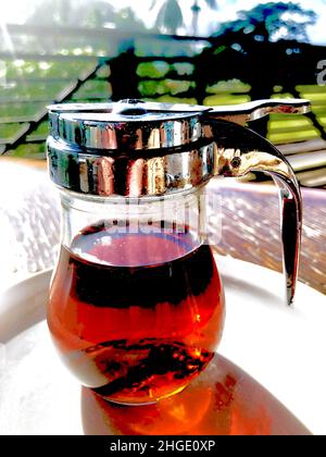 medicinal syrup in a bottle of dark glass stands in a pharmacy against ...