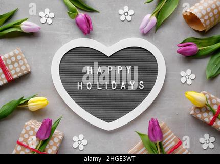 Happy Holidays text on felt heart shaped letter board, letterboard in ...