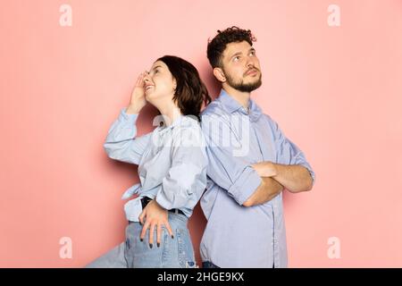 Family and sport concept - Two acrobat twins girls on the twine and ...