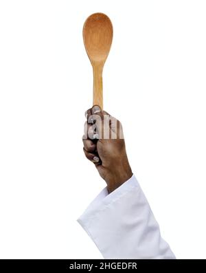 A chef arm holding wood spoon with white background Stock Photo - Alamy