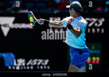 Marcus Giron flattening the ball with his racquet in a match against ...