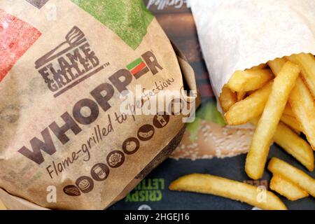 Burger King Whopper in wrapper on white background. Cut out Stock Photo ...