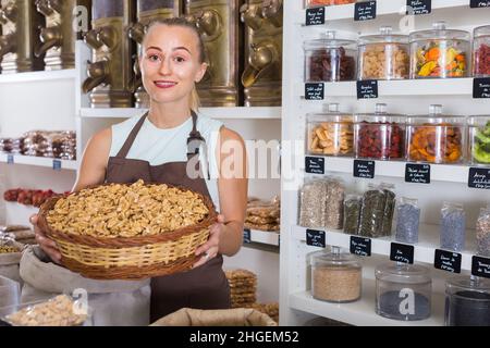 Female is selling walnut Stock Photo - Alamy