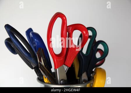 Used scissors in black with blue color on white background Stock Photo ...