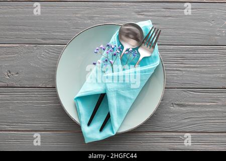 Elegant table setting with gypsophila flowers on yellow background ...