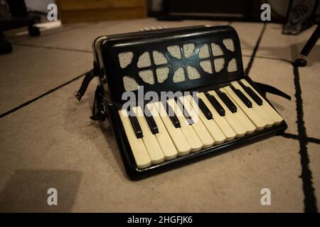 Small miniature piano on the floor of a music recording studio Stock ...