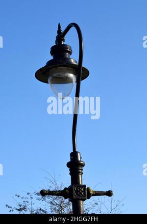 A low angle view of street light in background of blue sky Stock Photo ...