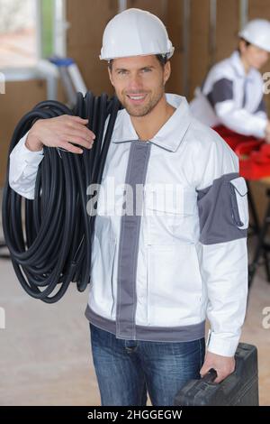Man doing electrical repairs Stock Photo - Alamy